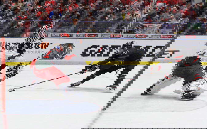 Canadian player Akil Thomas, right, scoring the winning goal against ...