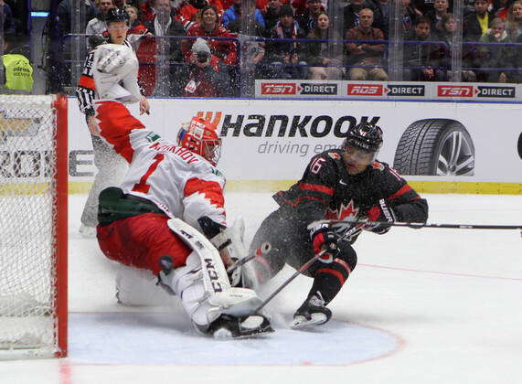 Canadian player Akil Thomas, right, scoring the winning goal against ...