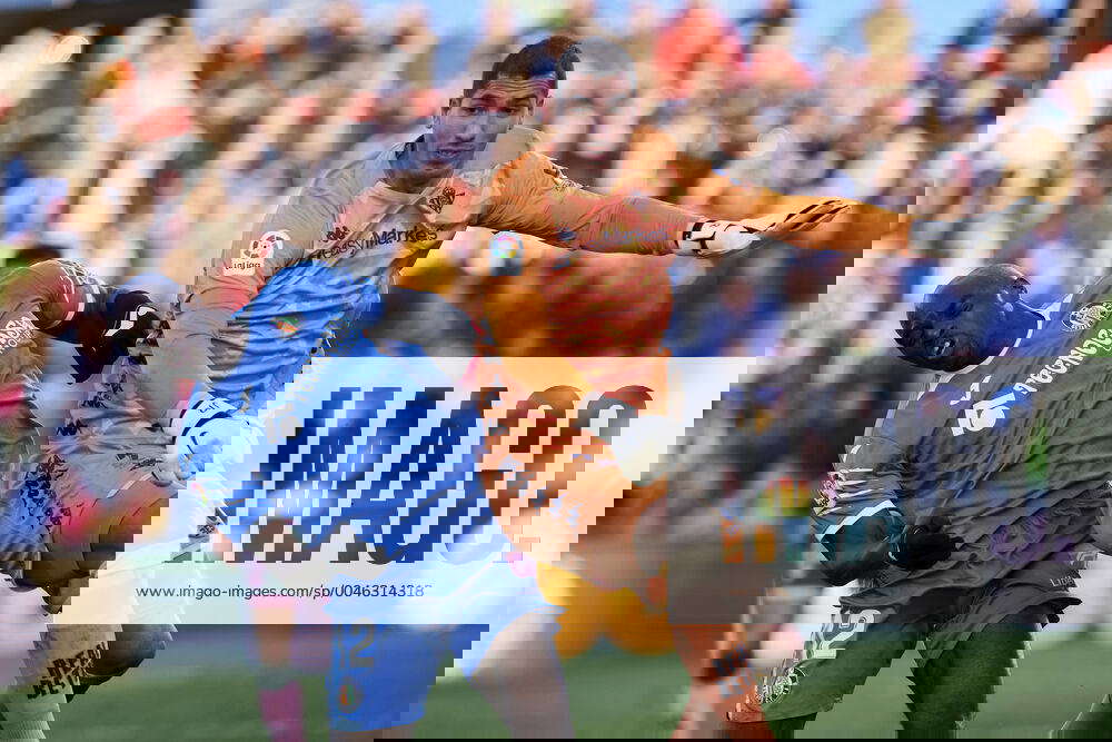 Allan-Romeo Nyom of Getafe FC and Joel Robles of Real Betis Balompie ...