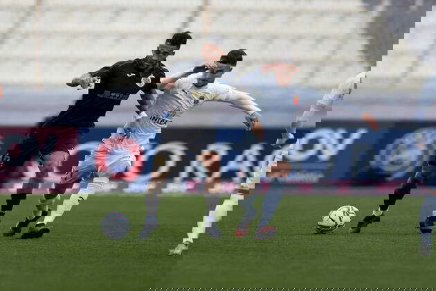 Gilmar Ribeiro Da Silva of Hibernians shields the ball away from Eslit ...