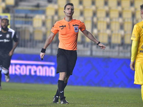Central referee Rares George Vidican with Pol Roige Rodriguez in the football match between