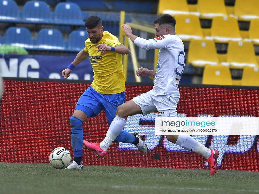Marius Fotescu and Dan Lucian Panait in the football match between ...