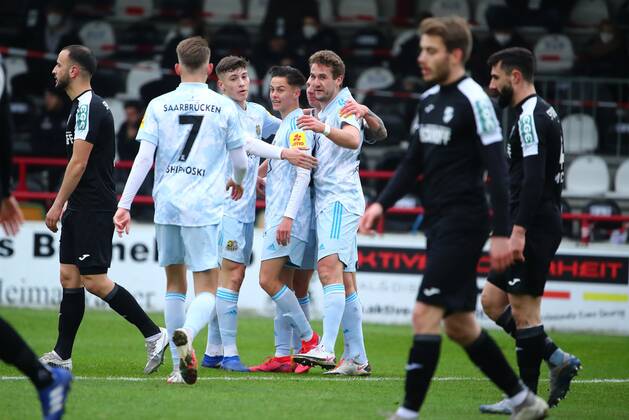 Saarbruecken players celebrate scoring the 1 0 goal against Verl, from ...