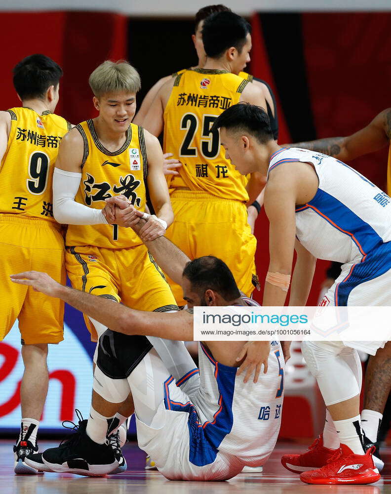 ZHUJI, Huang Rongqi of Jiangsu Dragons helps Hamed Haddadi of Sichuan ...