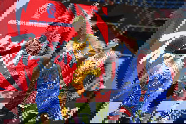 ZHUJI, Huang Rongqi of Jiangsu Dragons helps Hamed Haddadi of Sichuan ...