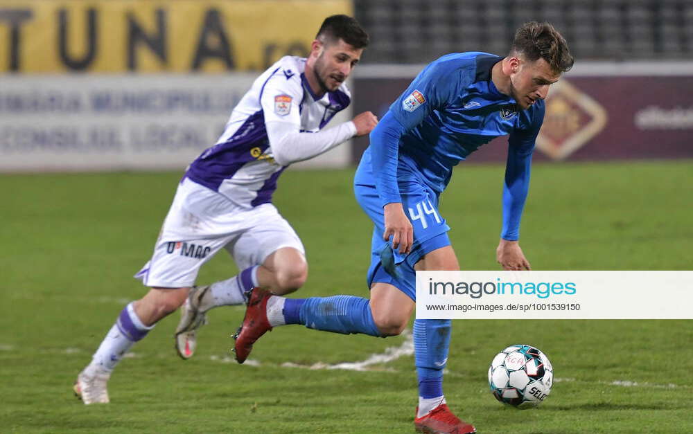 Ionut Adrian Serban and Lucian Mihai Dumitriu in the football match ...