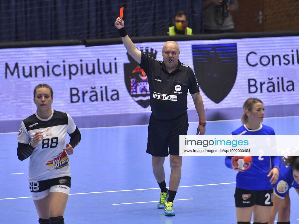 The referee Robert Harabagiu gives a red card to the Buzau handball ...