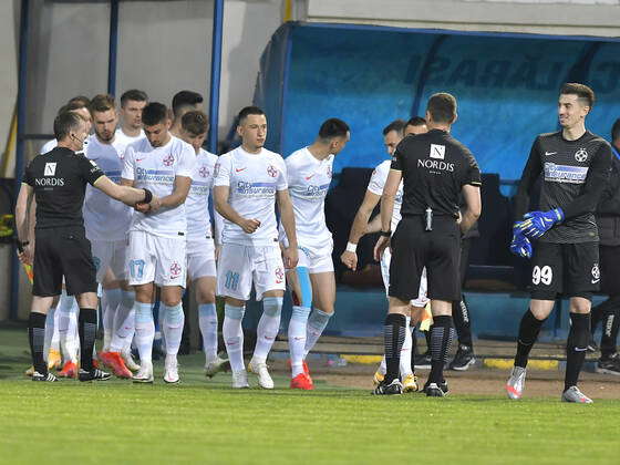 Star footballers Denis Gratian Harut and Florinel Teodor Coman greet ...