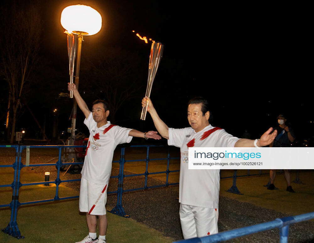 A torchbearer pose for camera during the last leg of the first day of ...