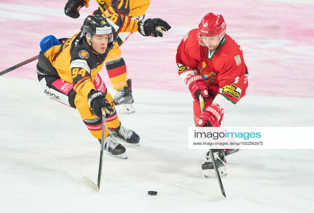 John PETERKA, DEB 94 compete, fight for the puck against Stanislav ...
