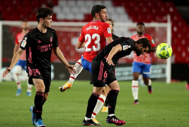 Real Madrid s defender Nacho Fernandez (R) vies for the ball with Al ...