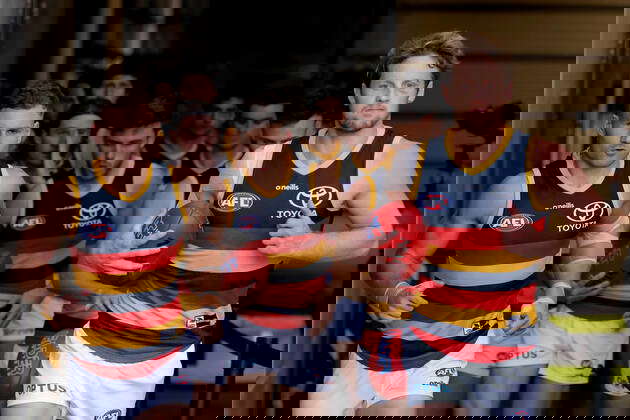 AFL EAGLES CROWS, Crows players enter the field before the start of ...