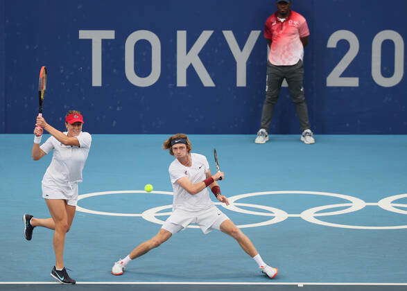TOKYO, JAPAN - : ROC athletes Anastasia Pavlyuchenkova and Andrey ...