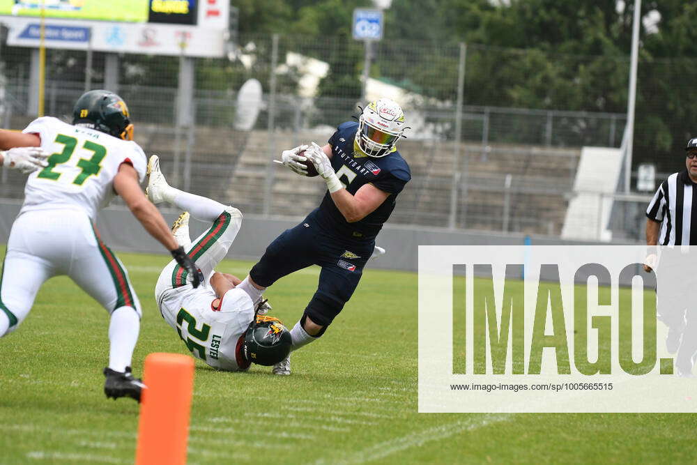 David Meza 5, tight end, Stuttgart Surge is tackled by Niko Lester 25 ...