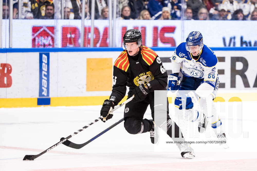 Brynäs Julius Bergman and Leksands Nils Aman during the ice hockey match in the SHL between Leksand