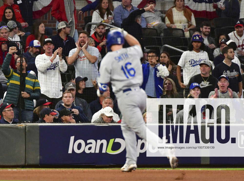 Los Angeles Dodgers fans cheer as Dodgers catcher Will Smith circles ...
