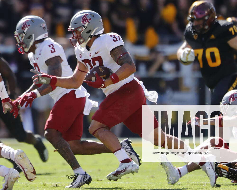 : Running back Dylan Paine of the Washington State Cougars carries the ...