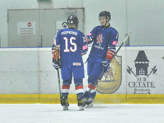 Logan Neilson is enjoying after a goal scored in the ice hockey match ...