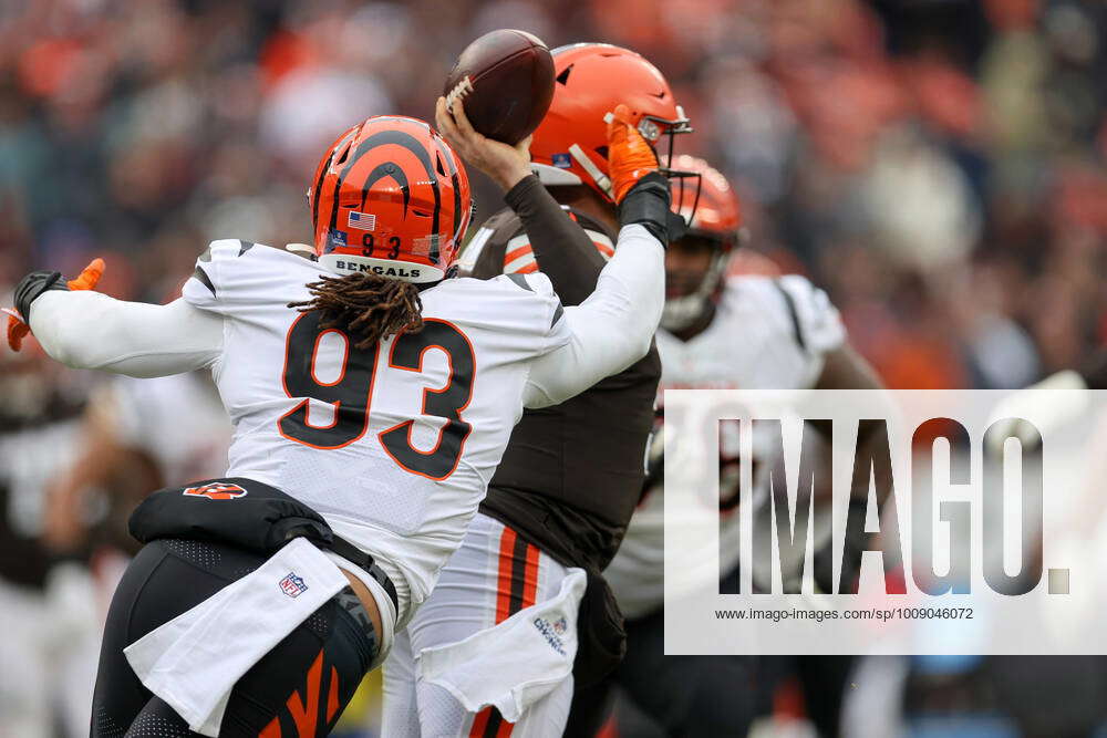 CLEVELAND, OH - JANUARY 09: A hit from Cincinnati Bengals defensive end ...