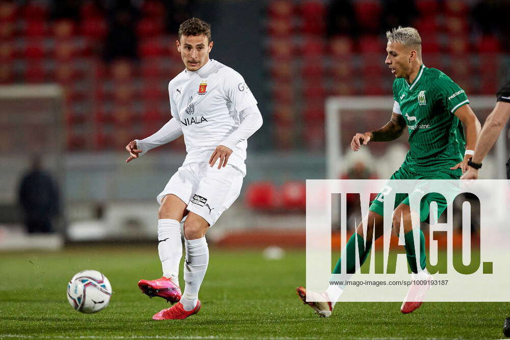 Eslit Sala (L) of Valletta passes the ball ahead of the challenge from ...