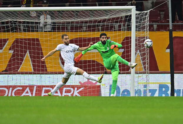 Goalkeeper Ismail Cipe of Galatasaray and Ahmet Engin of Kasimpasa ...