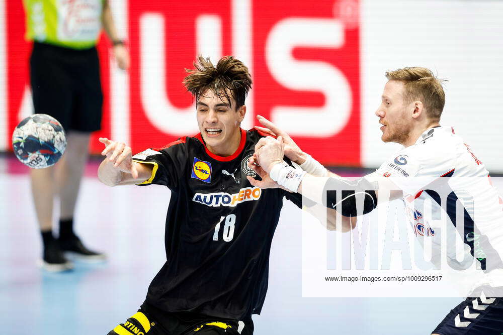 Julian KÖSTER (18) and Magnus GULLERUD (21) during the handball match ...