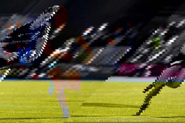 Harvey Beaton of Saracens makes a clear break from the line of play and ...