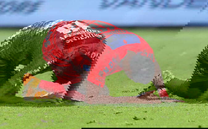 Kortrijk s Muhammed Badamosi looks dejected during a soccer match ...