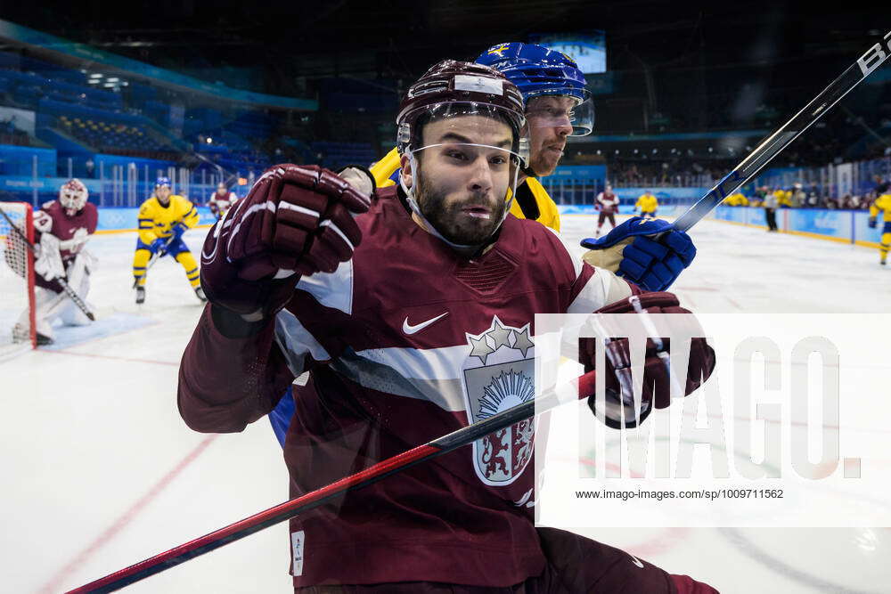 Janis Jaks of Latvia is being tackled by Joakim Nordström of Sweden in ...