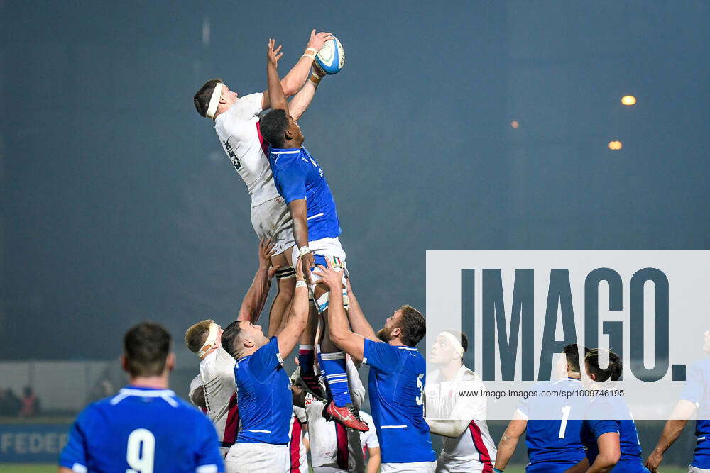Tom Lockett (England) hindered by Odiase David (Italy) during a touch ...