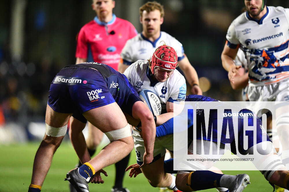 Harry Thacker of Bristol Bears is taken down by 2 Warriors during the ...