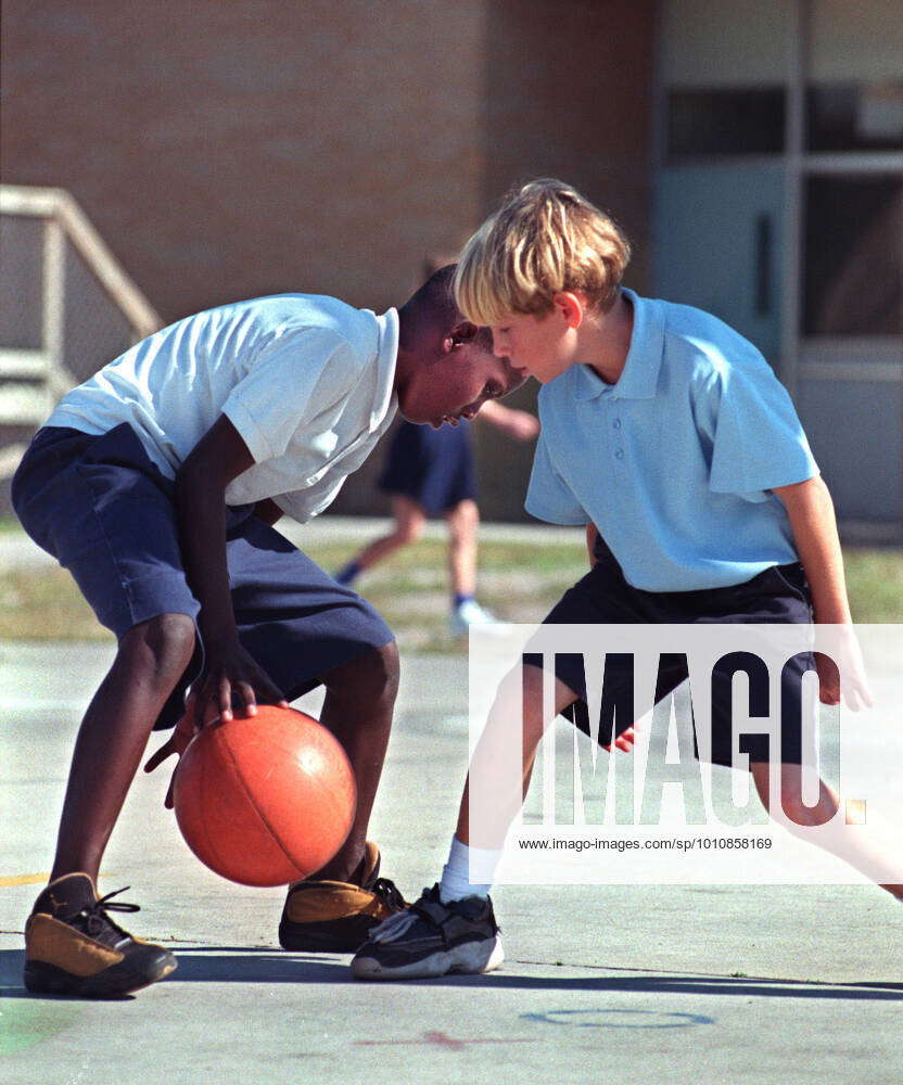 December 16, 1998, Tampa, Florida, USA: ADAM SCHULTZ (right), 11, and ...