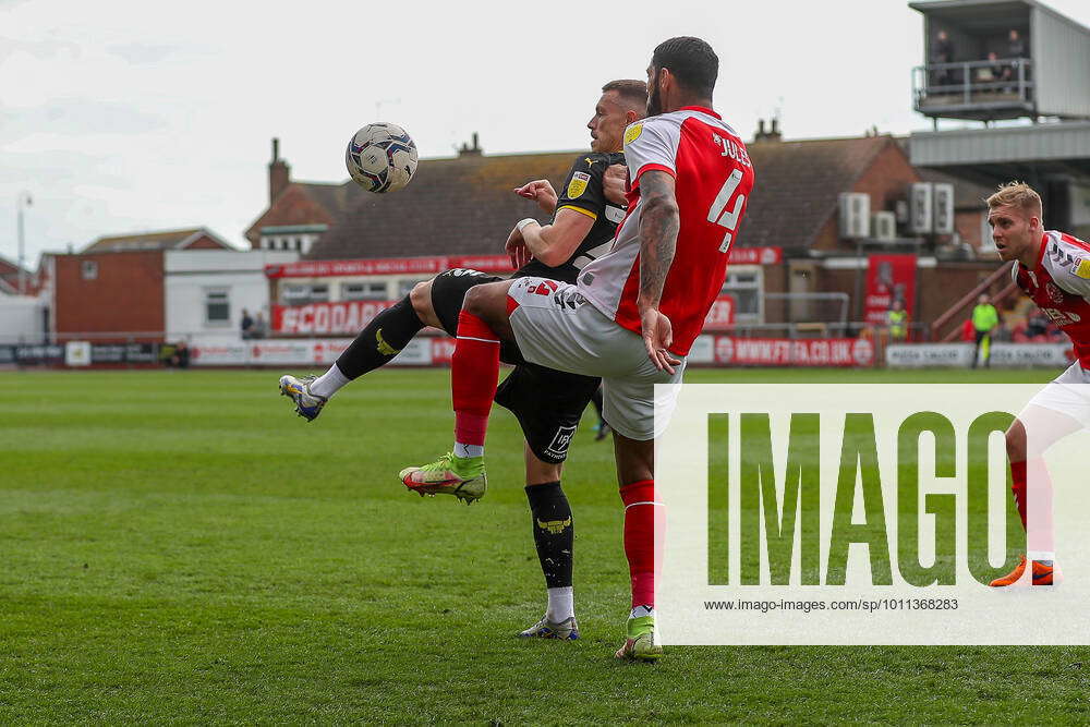 Oxfords Sam Long and Fleetwoods Zak Jules compete for the ball during ...