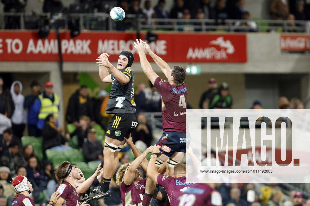 SUPER RUGBY HURRICANES REDS, Ryan Smith (right) of the Reds leaps for ...
