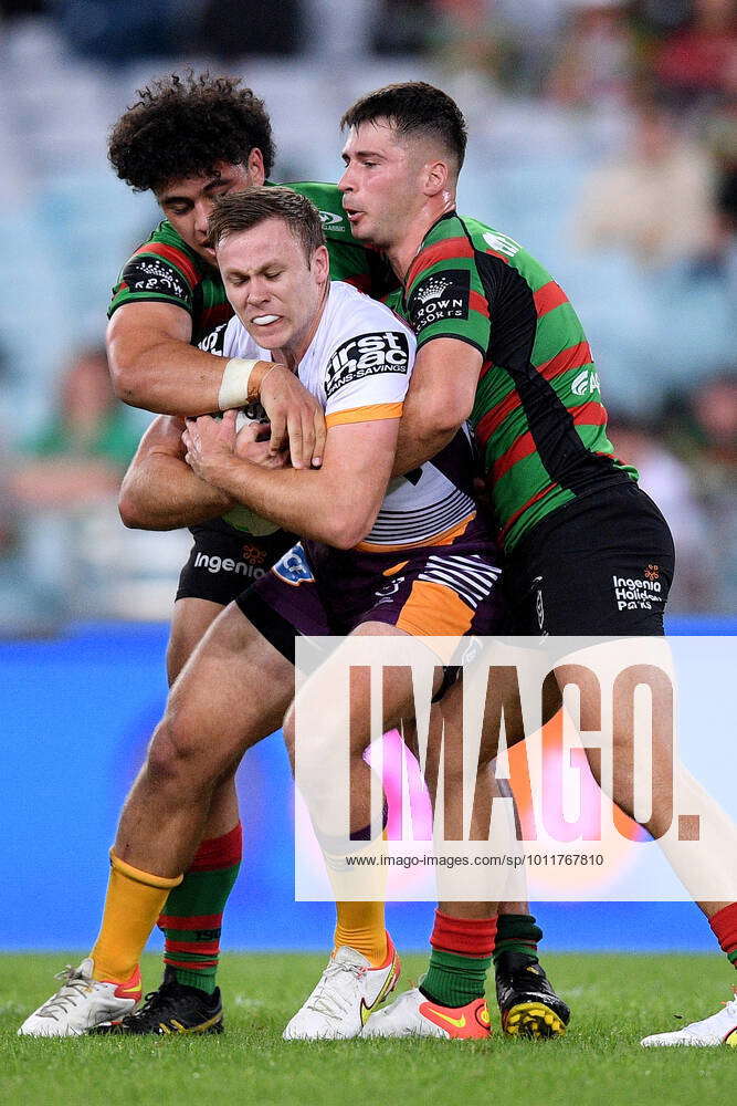 NRL RABBITOHS BRONCOS, Billy Walters of the Broncos is tackled by Davvy ...