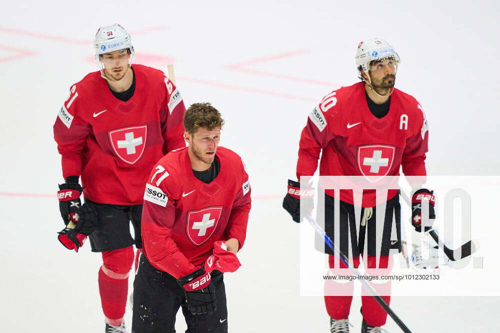 Enzo Corvi Nr. 71 of Switzerland (M) injury after check by Andrew Peeke ...