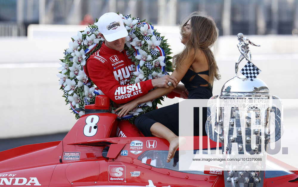 INDIANAPOLIS, IN - MAY 30: Marcus Ericsson helps his girlfriend Iris ...