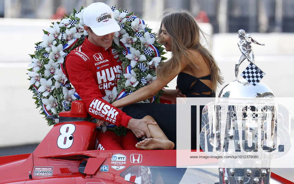 INDIANAPOLIS, IN - MAY 30: Marcus Ericsson helps his girlfriend Iris ...