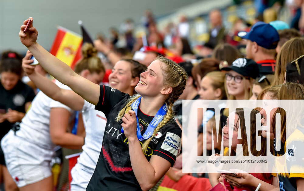 Lotte Clapp of Saracens Women with delighted supporters after their win ...