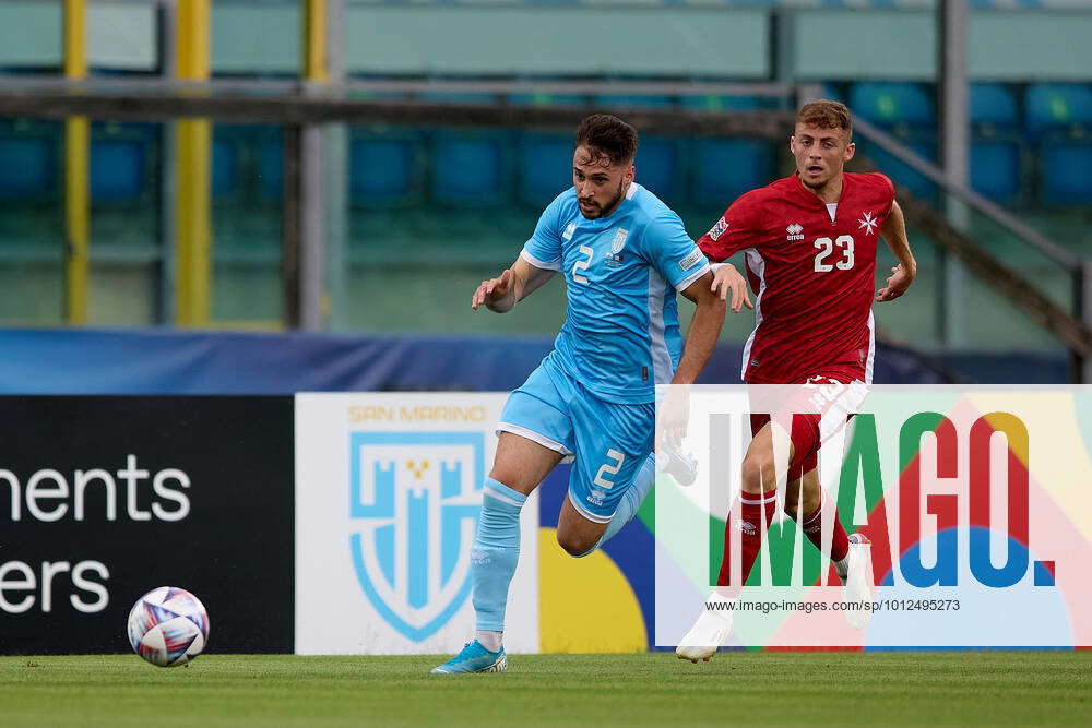 Malta national soccer team player Adam Magri Overend (R) closely ...