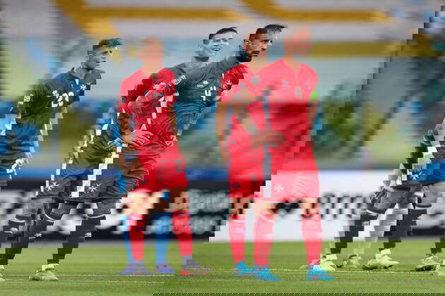 Malta national soccer team players Adam Magri Overend (R) and Enrico ...