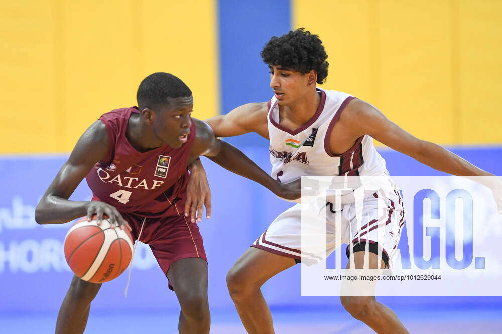 June 14, 2022, Doha, Ar Rayyan, Qatar: Mohamed Massamba Ndao (L) of the Qatar Basketball team and