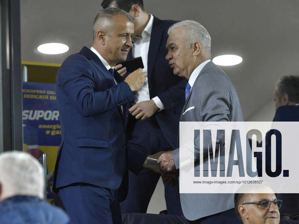 Gabriel Bodescu and Anghel Iordanescu discuss in the stands at the ...