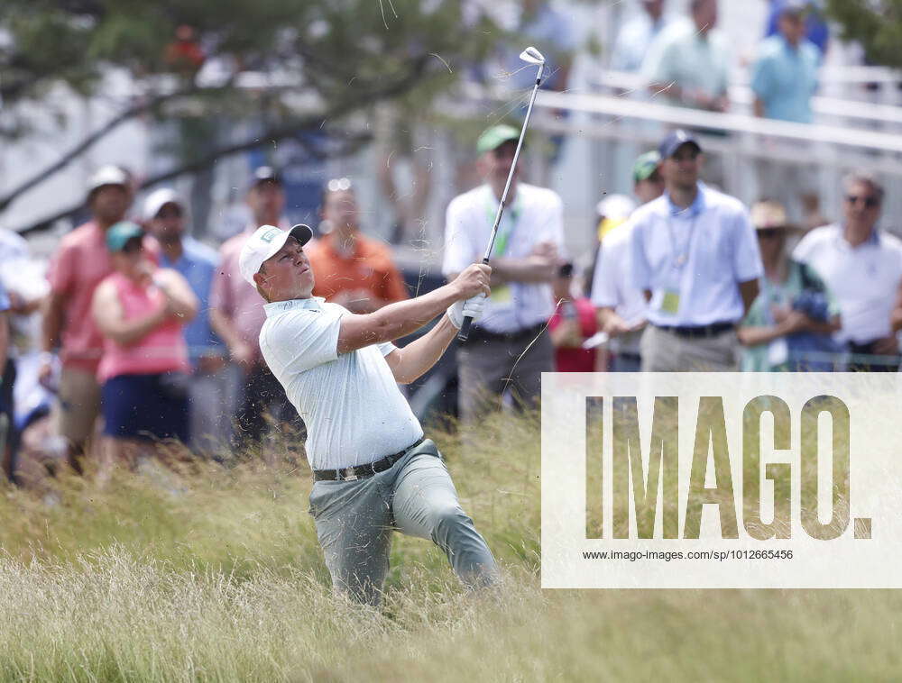 M.J. Daffue of South Africa hits his approach shot to the 18th green ...