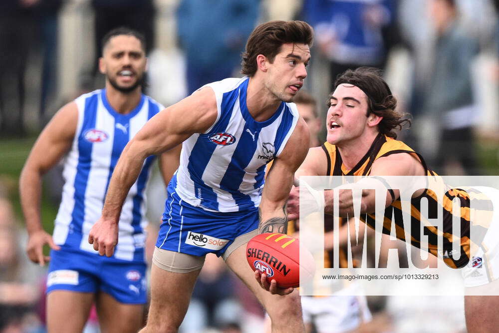 AFL KANGAROOS HAWKS, Jai Newcombe of Hawthorn tackles Jy Simpkin of ...