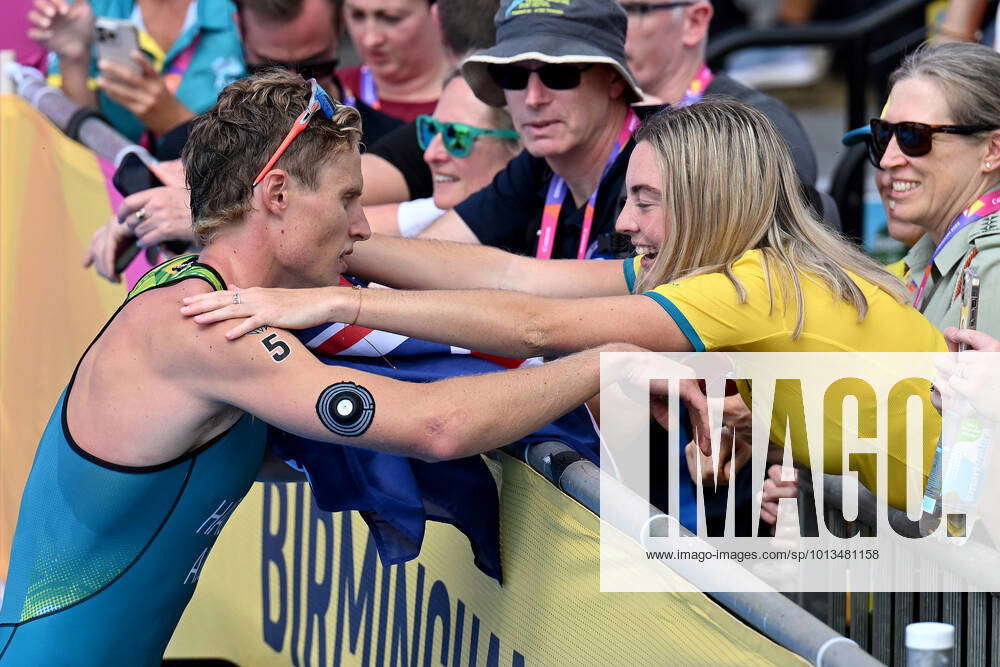 COM22 TRIATHLON, Matthew Hauser of Australia celebrates after finishing ...