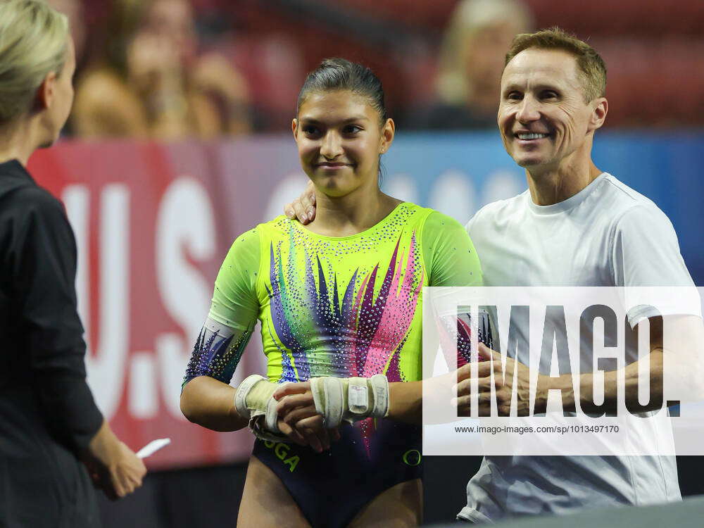 July 29, 2022: WOGA coach Valeri Liukin congratulates Madray Johnson ...