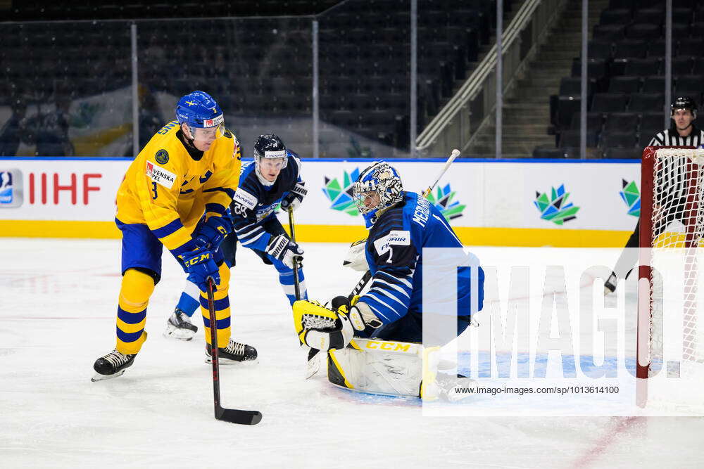 220804 Helge Grans of Sweden scores 0 1 behind goaltender Leevi ...