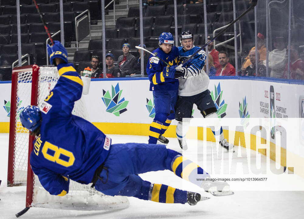 EDMONTON, AB, CANADA: Sweden s Leo Loof falls as Mans Forsfjall and ...