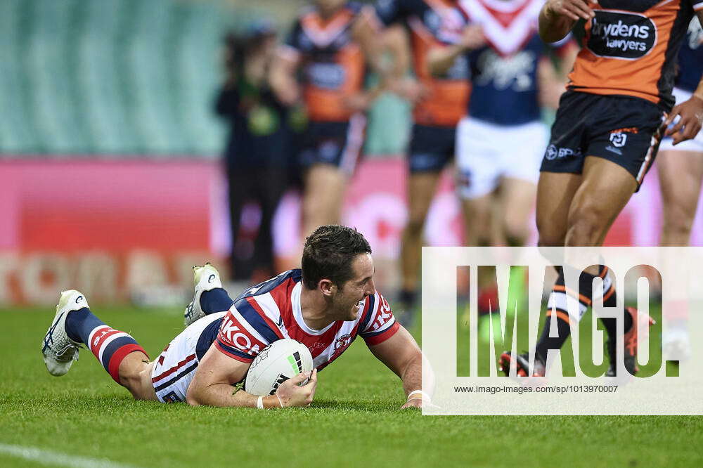 NRL ROOSTERS TIGERS, Nat Butcher of the Roosters scores a try during ...